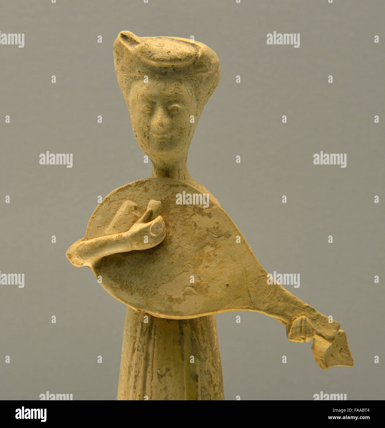 White glazed pottery figurine of woman playing pipa hi-res stock ...