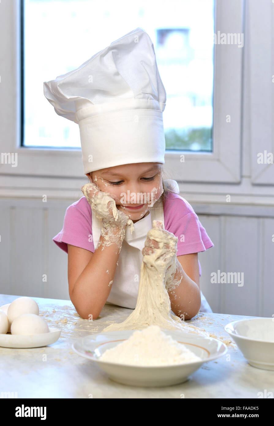 Little cooking in kitchen Stock Photo - Alamy