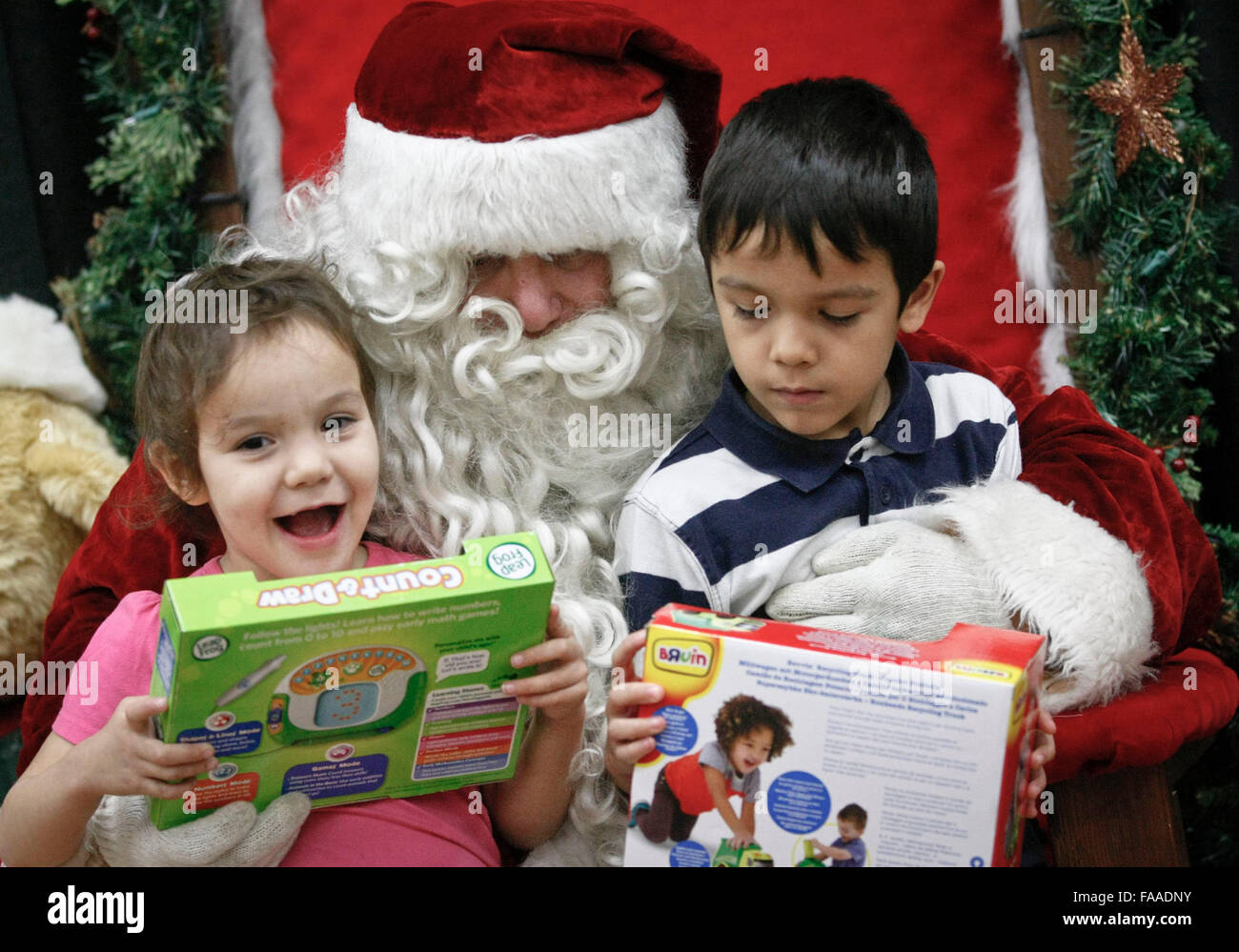 Vancouver, Canada. 24th Dec, 2015. Children receive toys from Santa ...