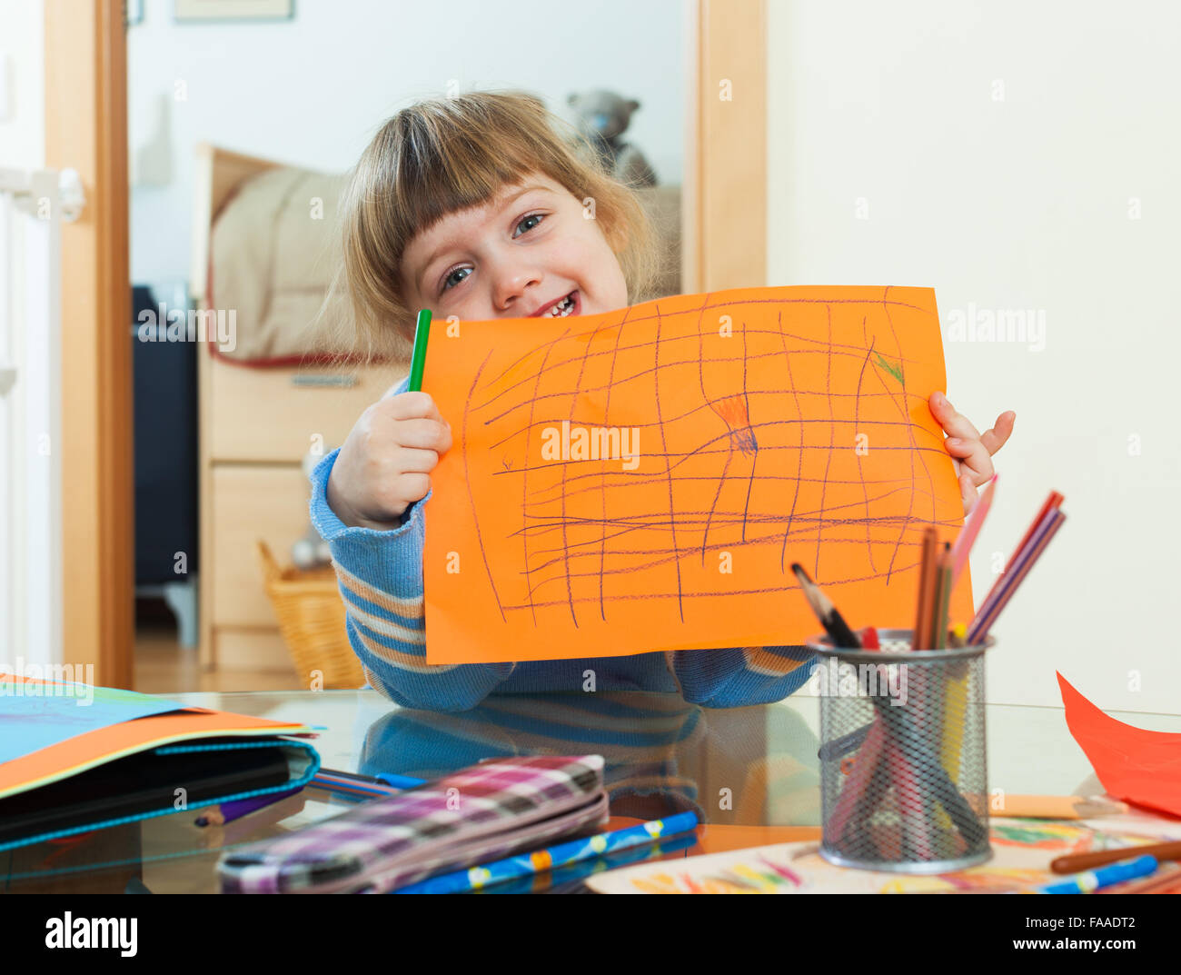 three year old child drawing on paper in home interior Stock Photo - Alamy