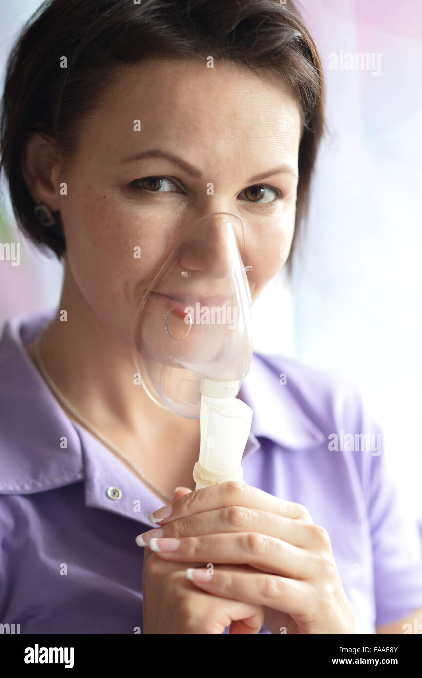 Young woman doing inhalation Stock Photo - Alamy