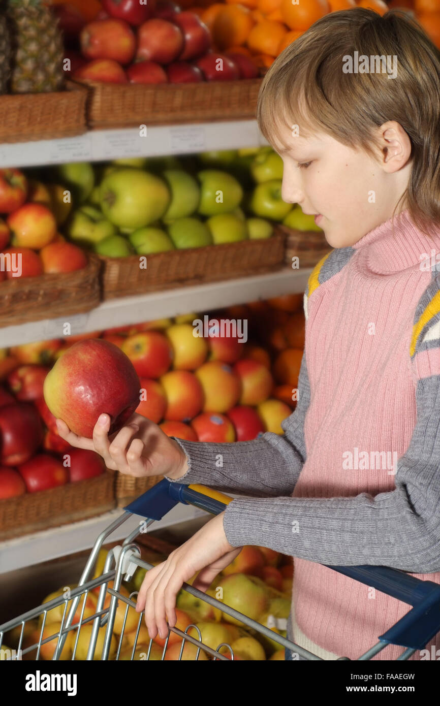 Interesting boy in the store Stock Photo - Alamy