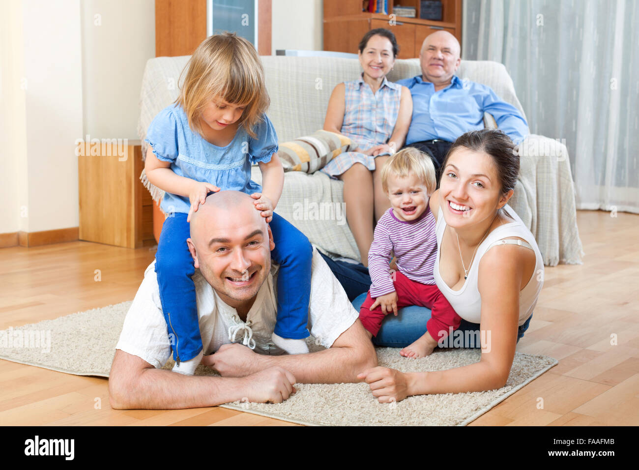 Portrait of smiling happy multigeneration family with two children ...