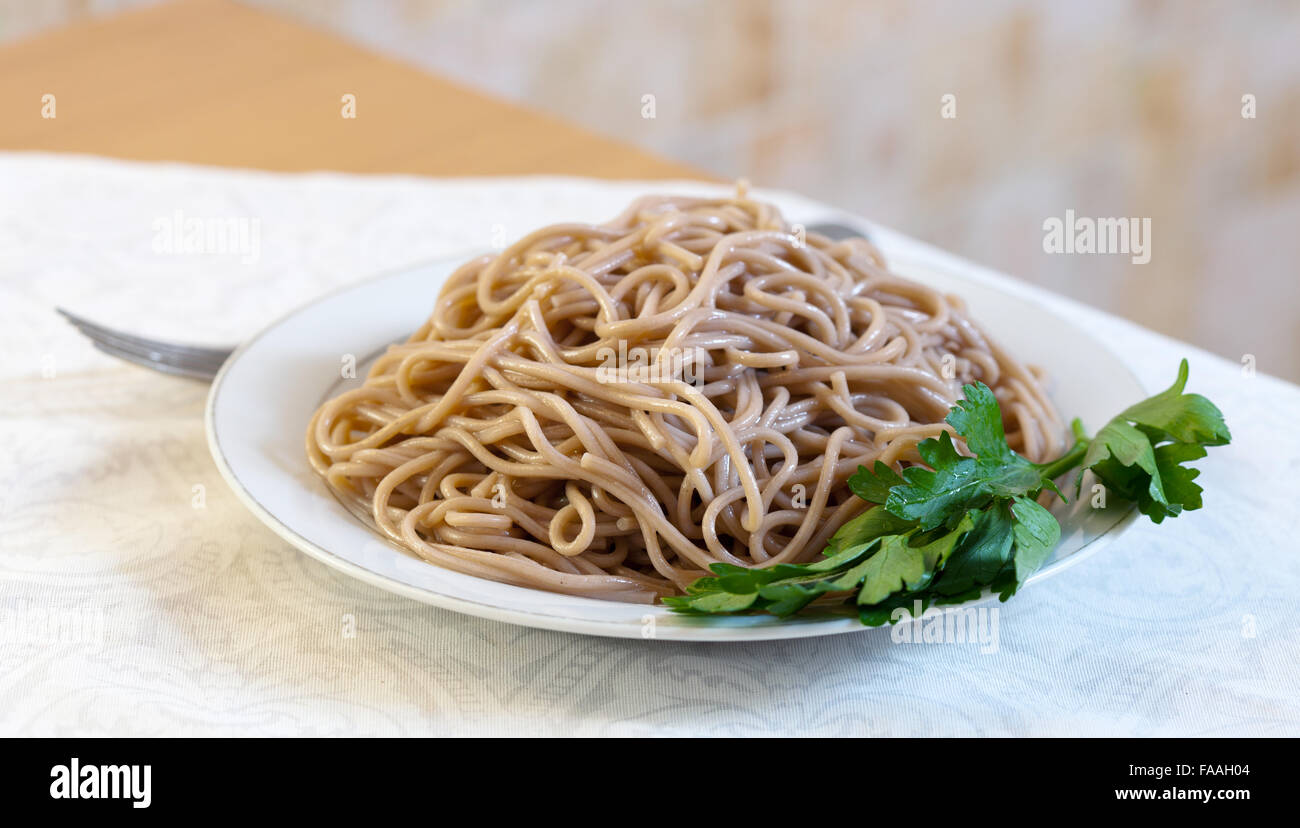 boiled buckwheat spaghetti pasta in plate on table Stock Photo - Alamy