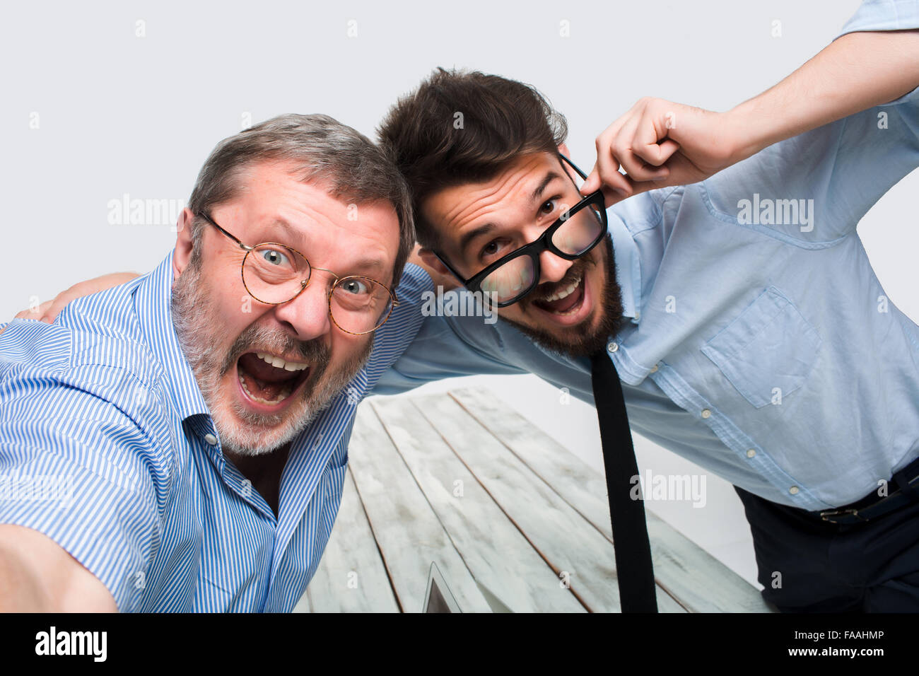 Two colleagues taking the picture to them self sitting in office Stock ...