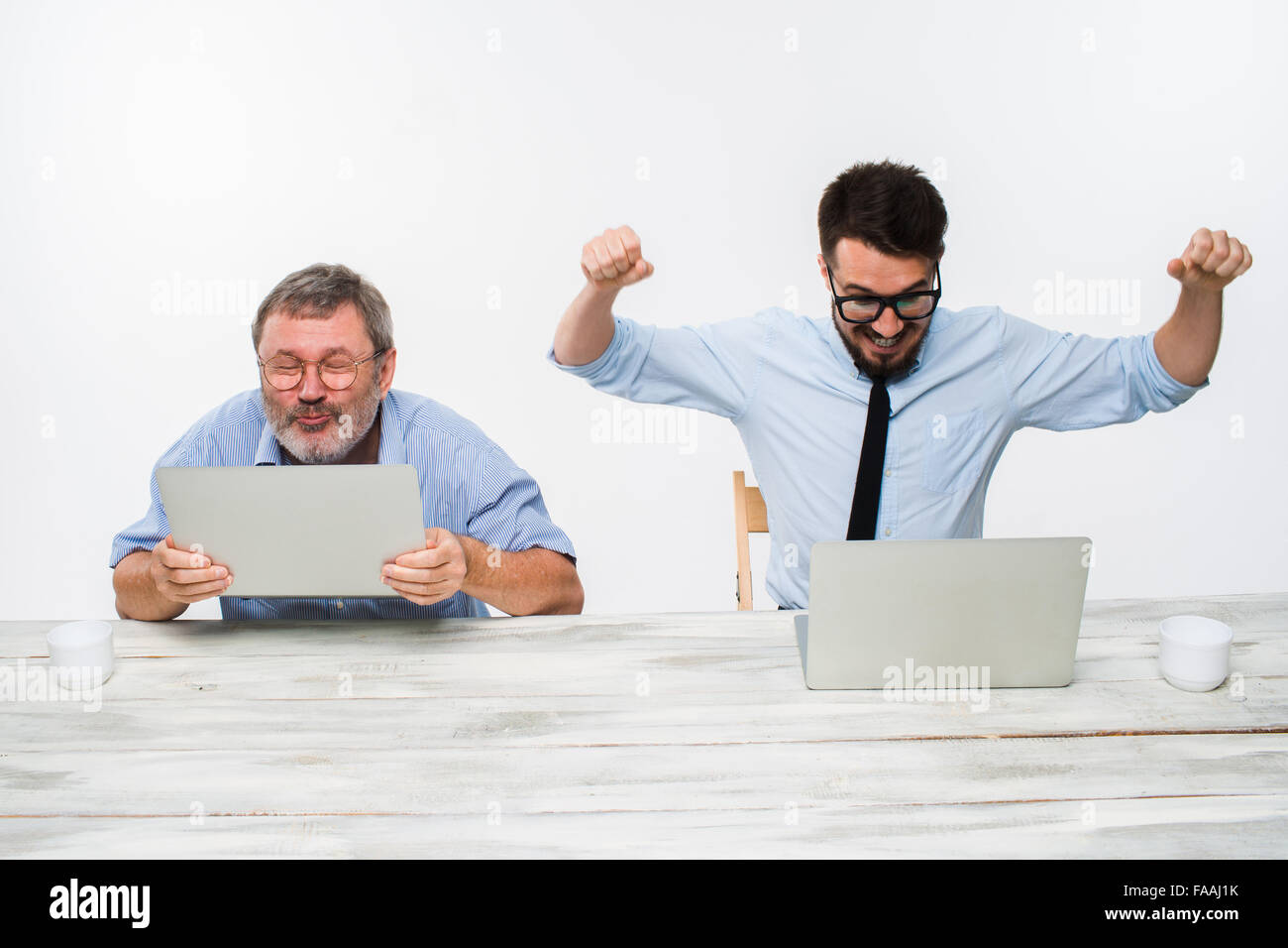 The two colleagues working together at office on white background Stock ...