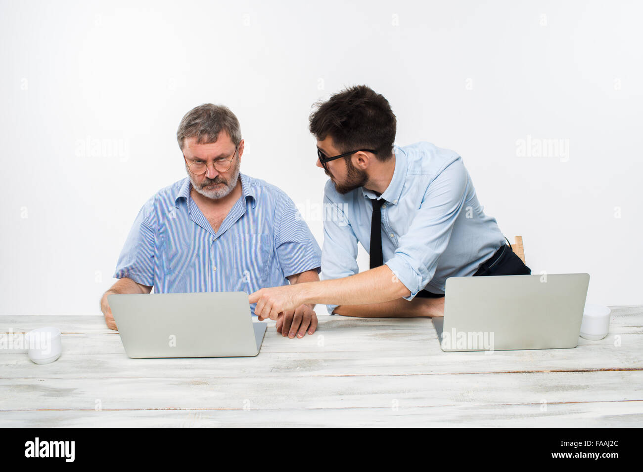 The two colleagues working together at office on white background Stock ...