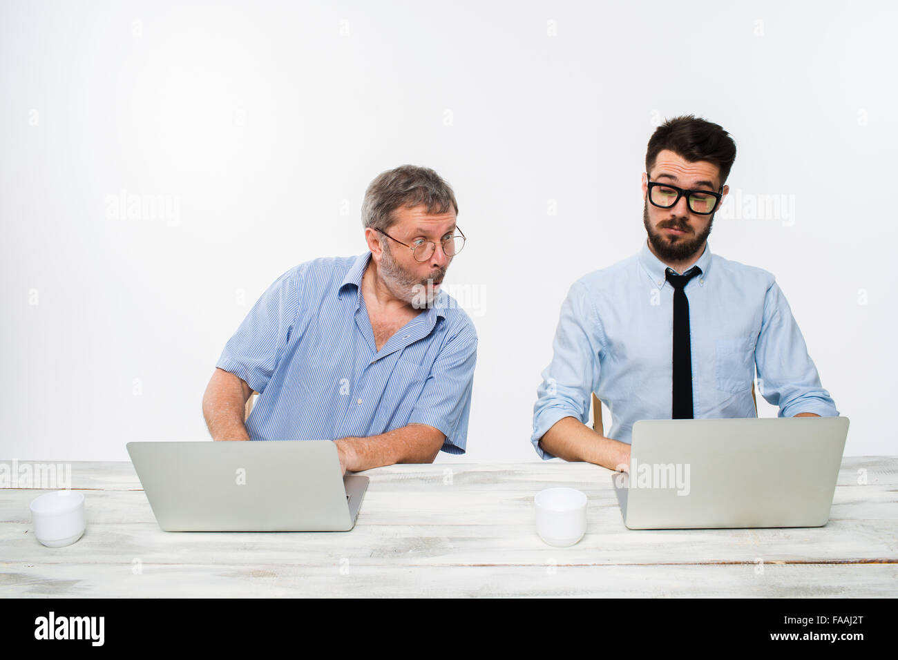 The two colleagues working together at office on white background Stock ...