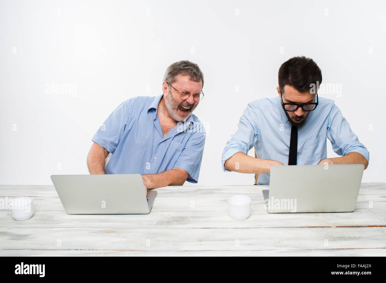 The two colleagues working together at office on white background Stock ...