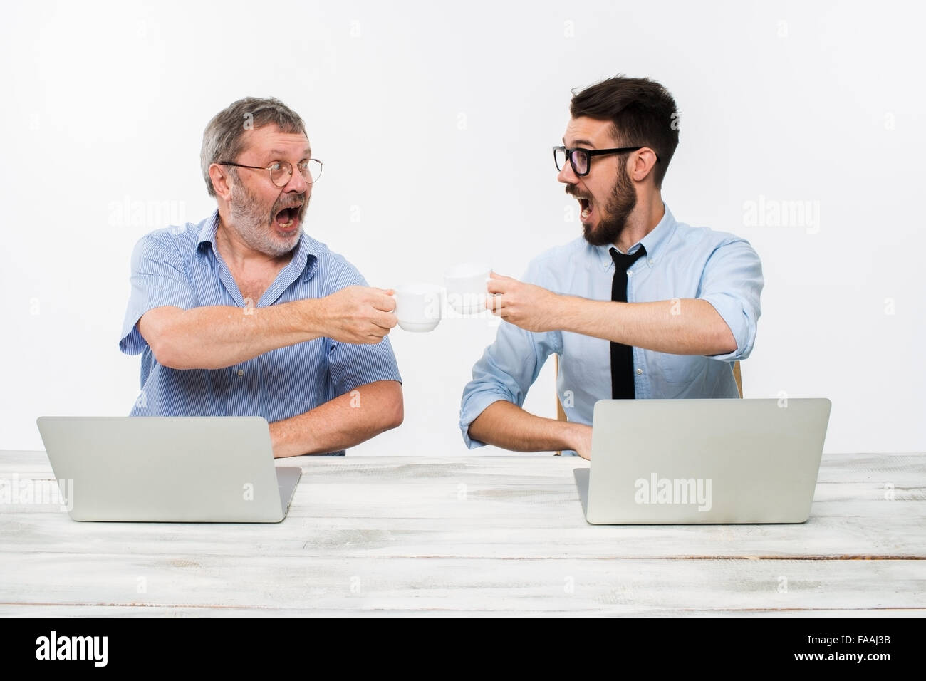 The two colleagues working together at office on white background Stock ...