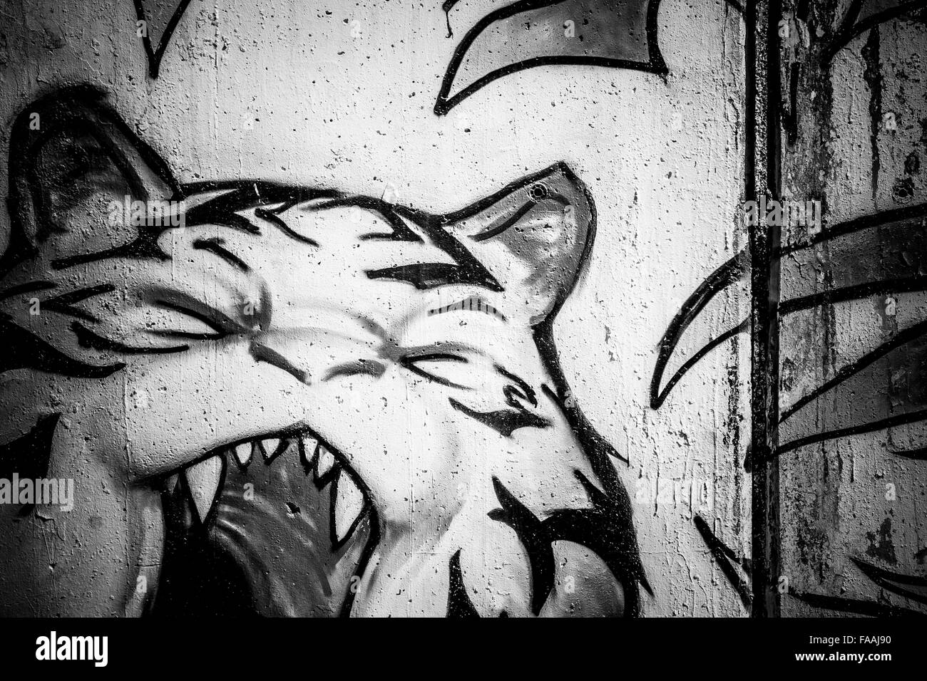 black ink grafitti design in city wall, street art segment Stock Photo ...