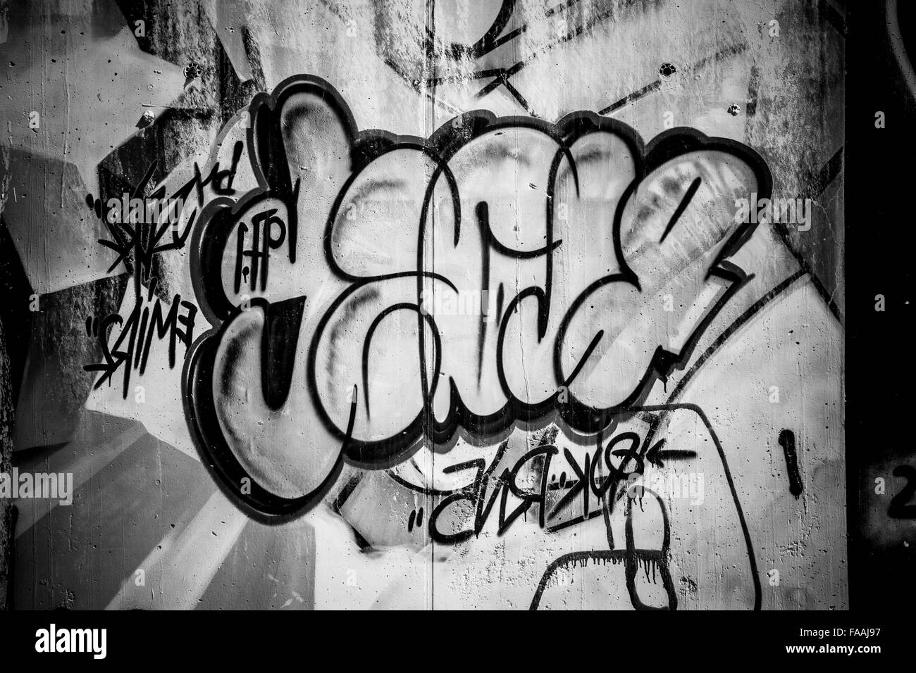 black ink grafitti design in city wall, street art segment Stock Photo ...