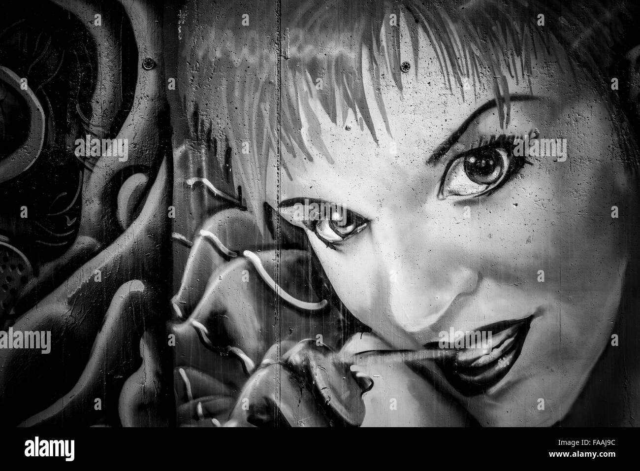 black ink grafitti design in city wall, street art segment Stock Photo ...