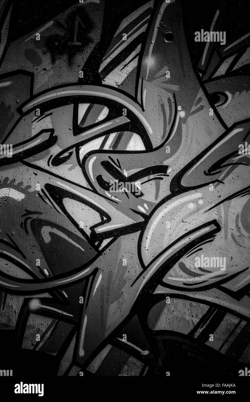 black ink grafitti design in city wall, street art segment Stock Photo ...