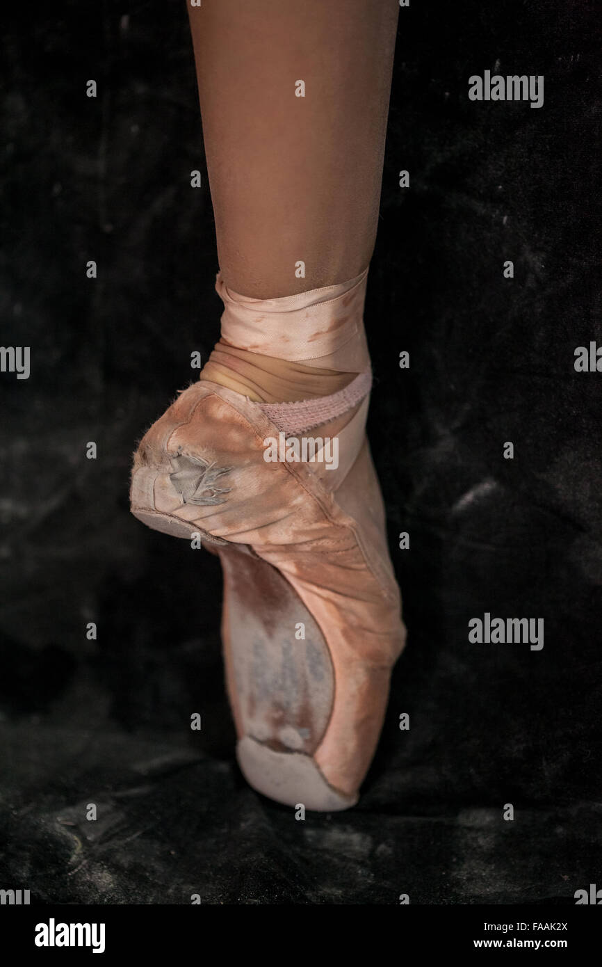 The close-up foot of young ballerina in old pointe shoes Stock Photo ...