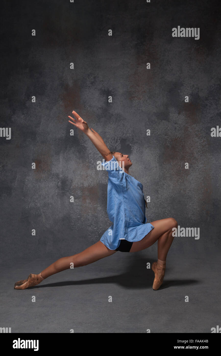 Young beautiful modern style dancer posing on a studio background Stock ...