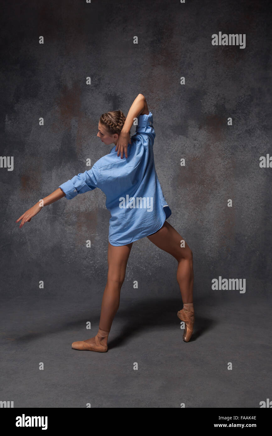 Young beautiful modern style dancer posing on a studio background Stock ...