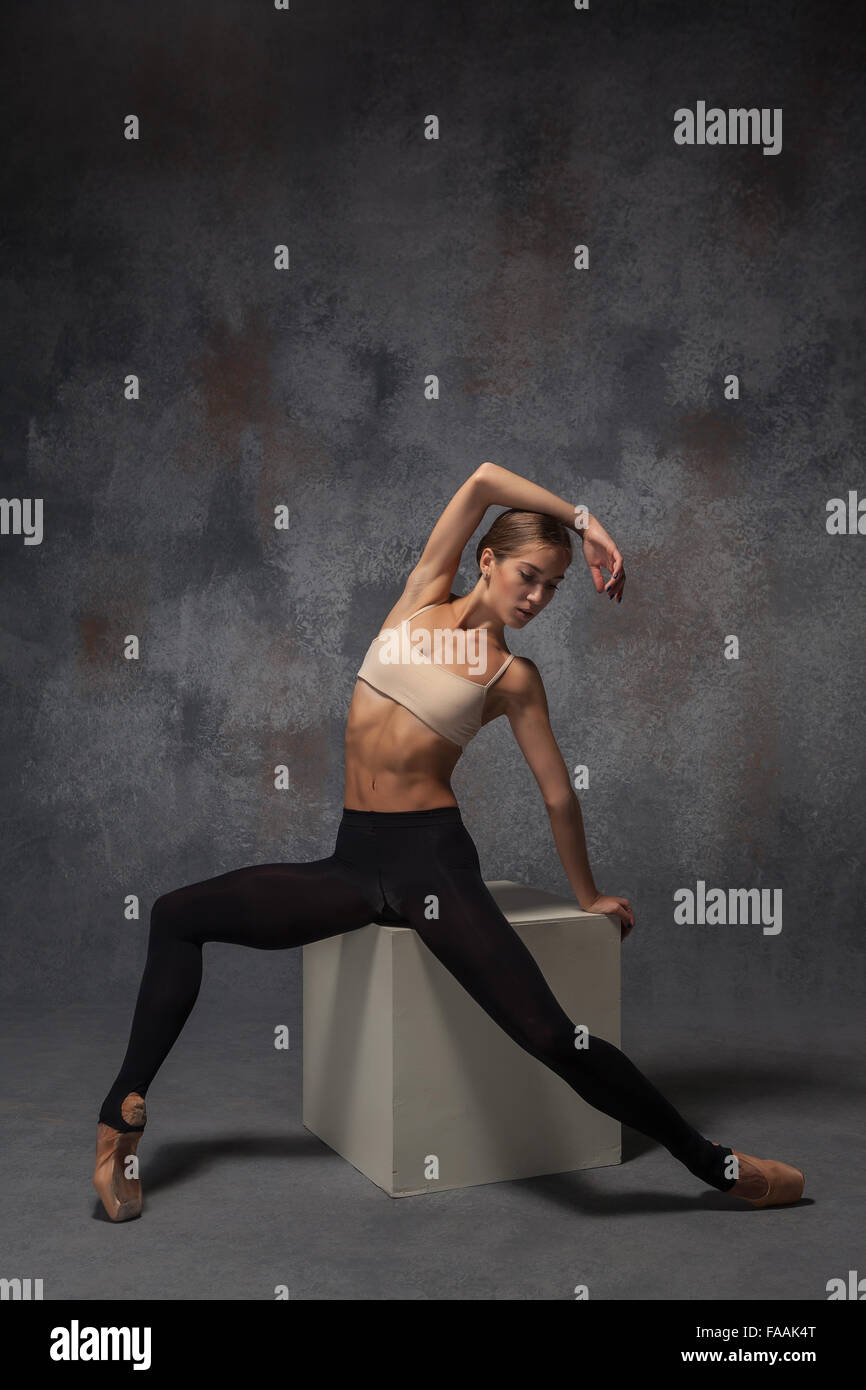 Young beautiful modern style dancer posing on a studio background Stock ...