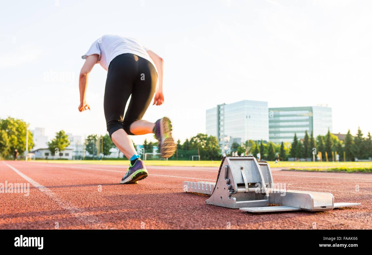 Side view of sprinter starting Stock Photo - Alamy