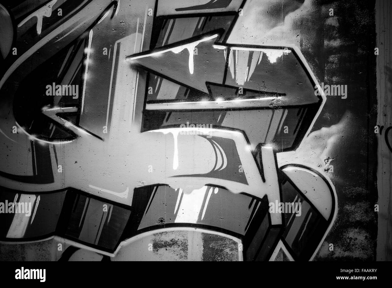 black ink grafitti design in city wall, street art segment Stock Photo ...