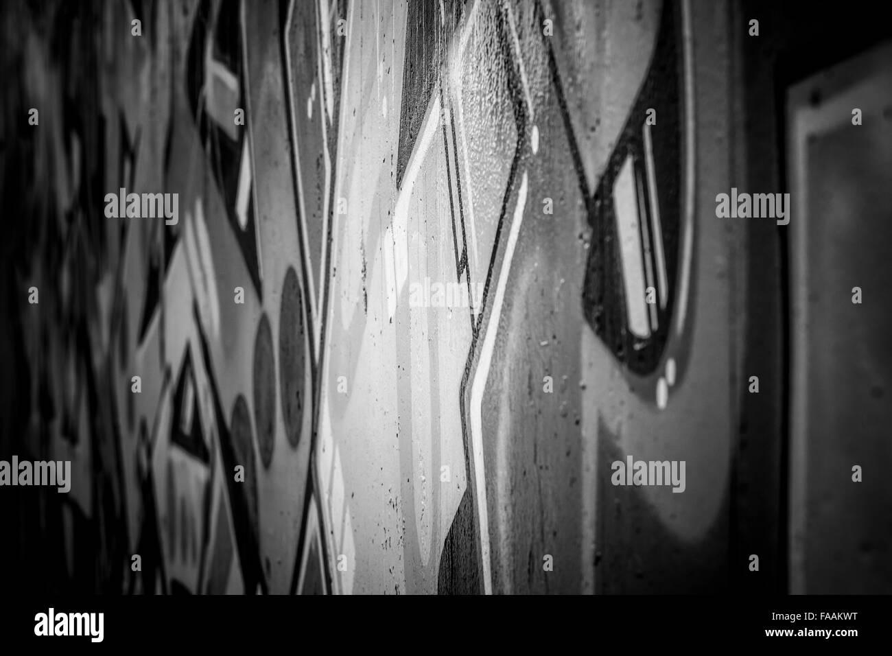 black ink grafitti design in city wall, street art segment Stock Photo ...