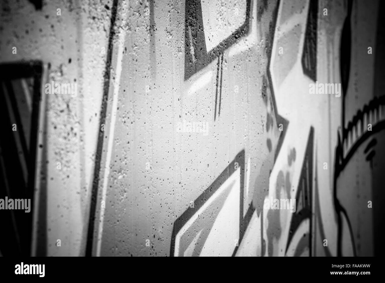 black ink grafitti design in city wall, street art segment Stock Photo ...