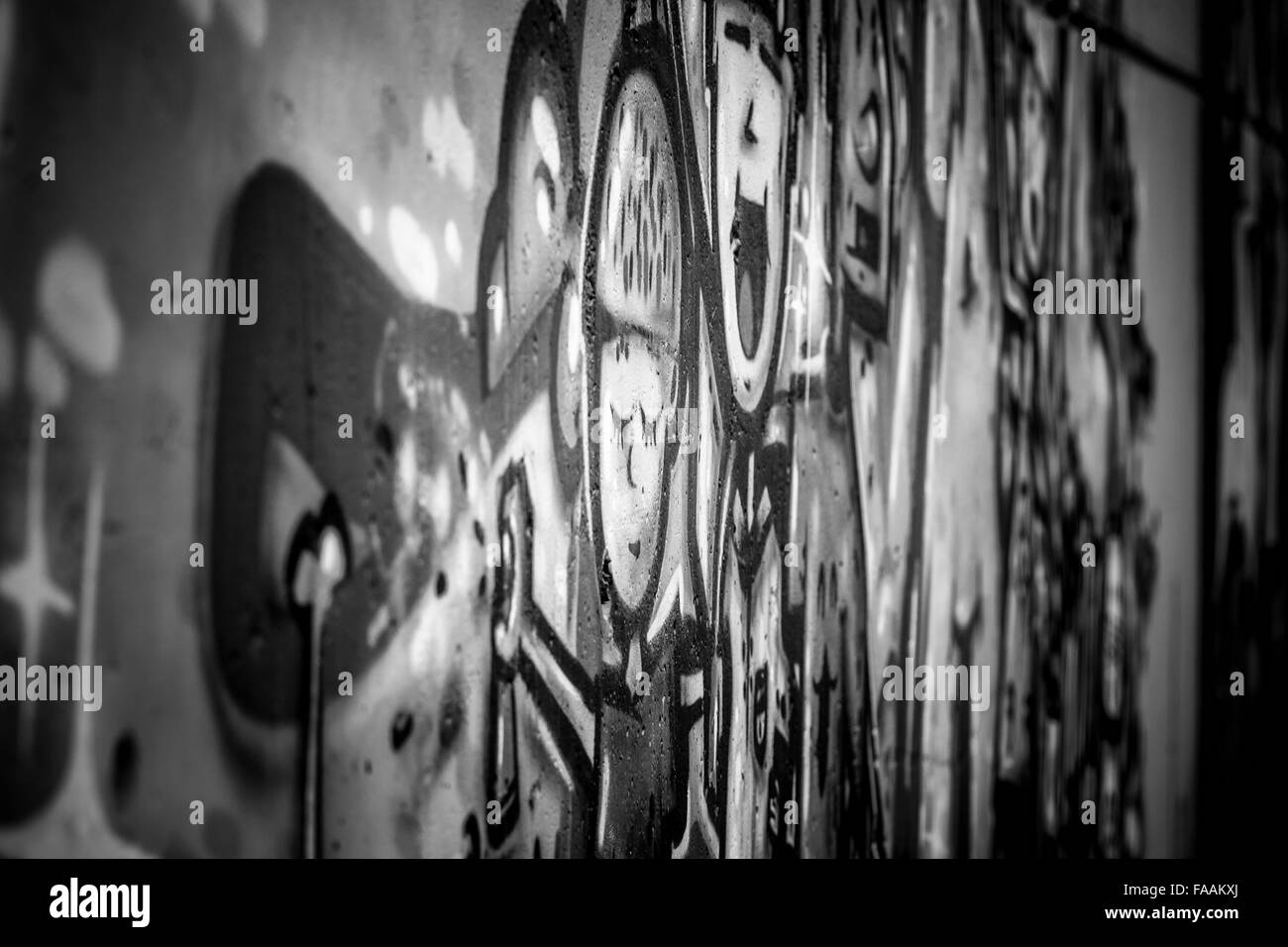 black ink grafitti design in city wall, street art segment Stock Photo ...