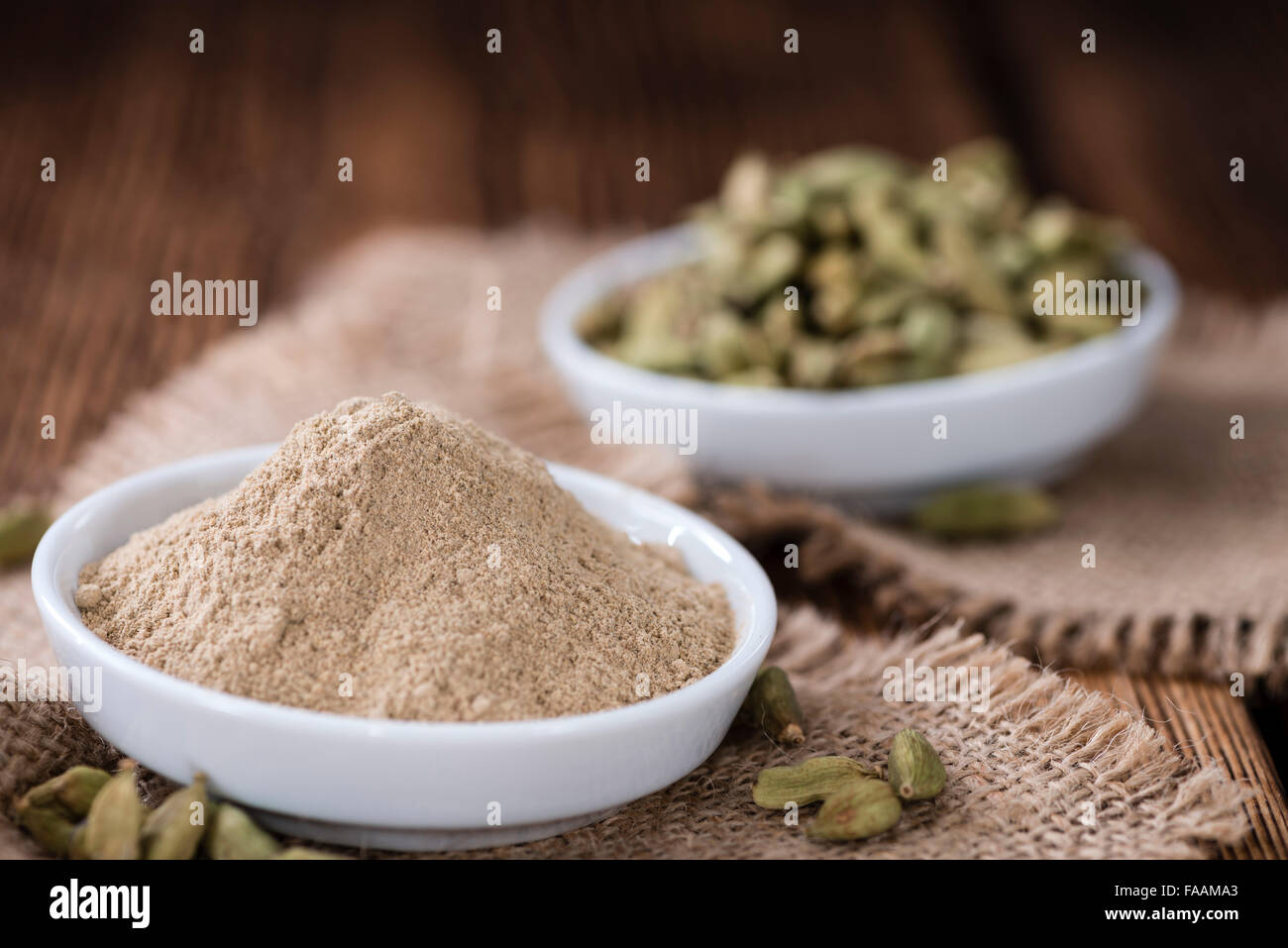 Portion of Cardamon Powder (close-up shot) on wooden background Stock ...