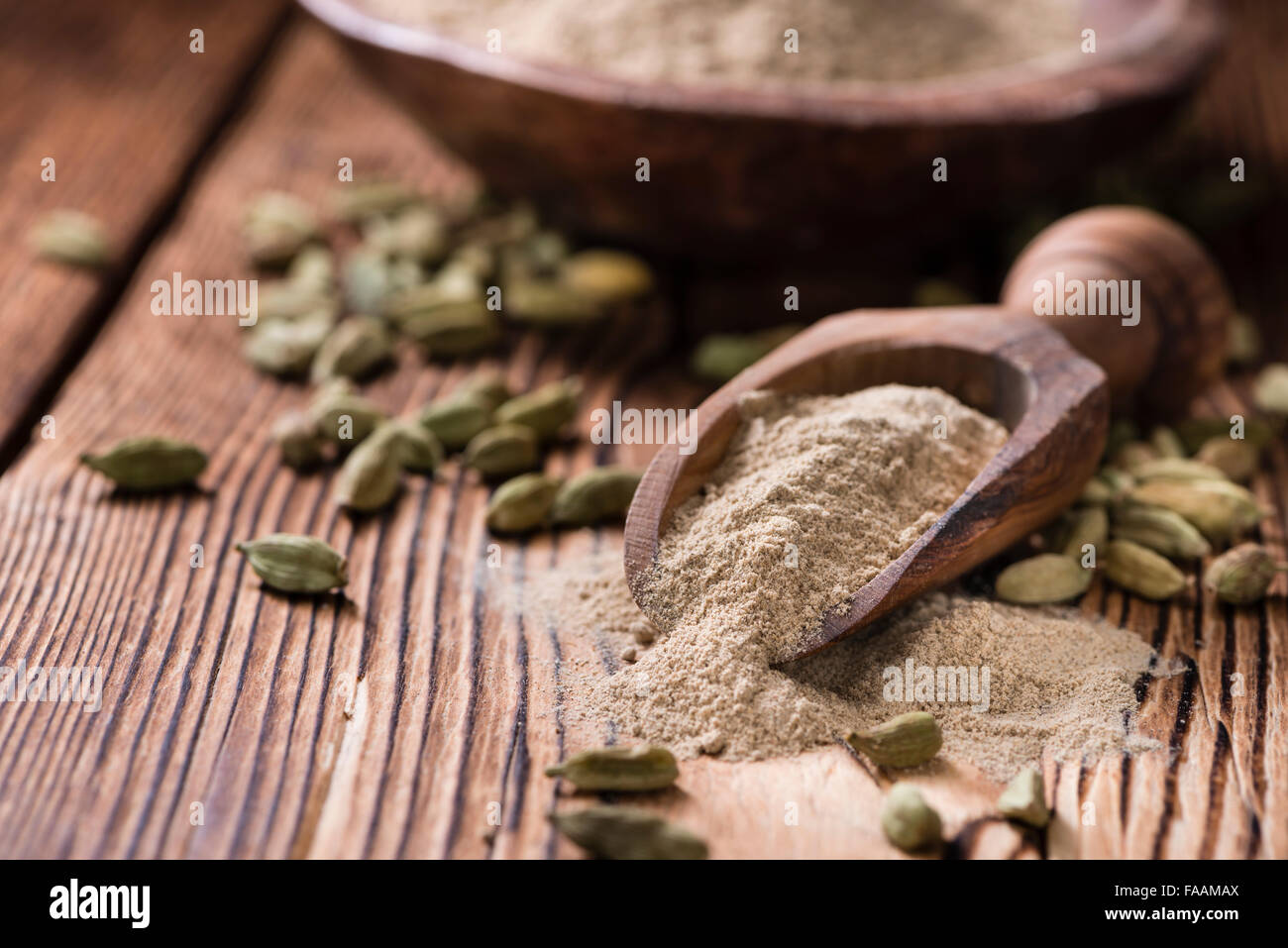 Portion of Cardamon Powder (close-up shot) on wooden background Stock ...