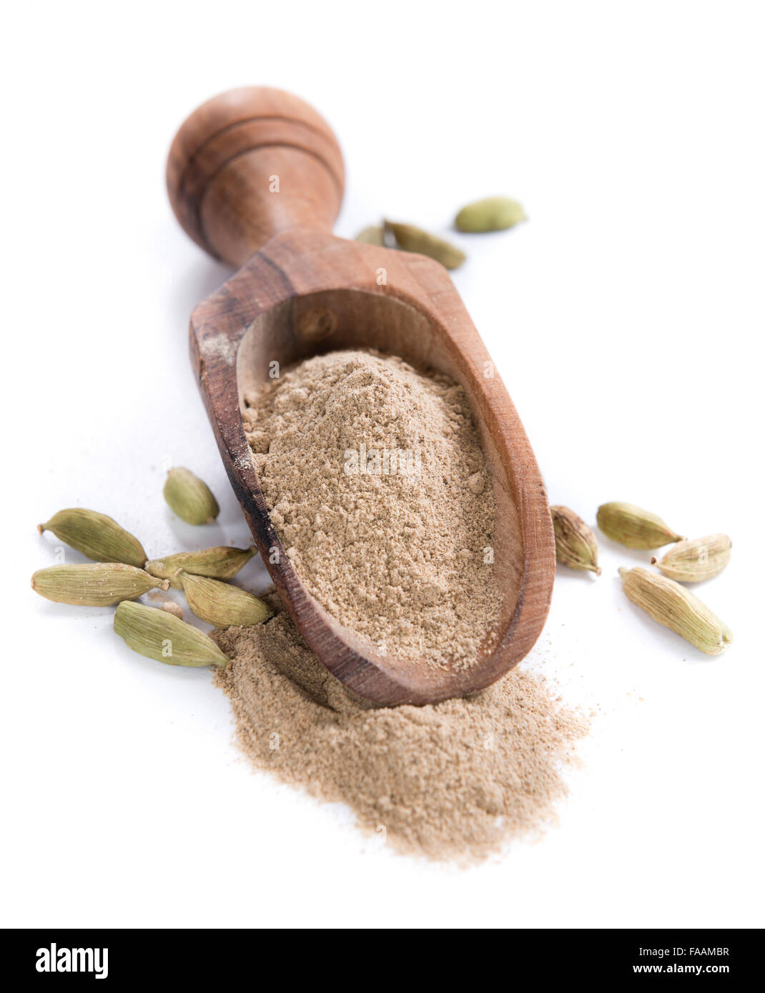 Portion of Cardamon Powder (close-up shot) isolated on white background ...