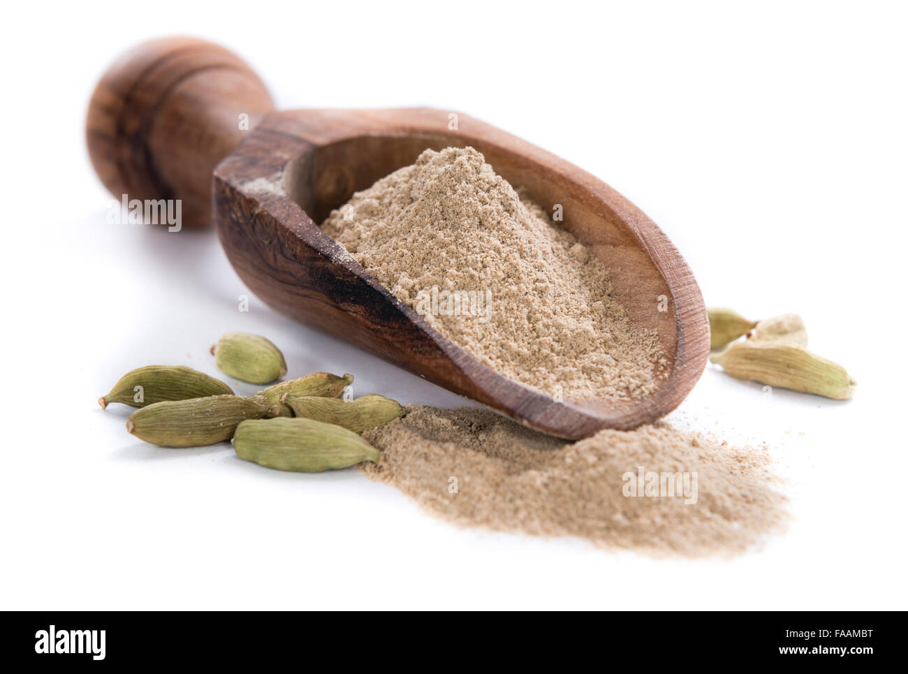 Portion of Cardamon Powder (close-up shot) isolated on white background ...