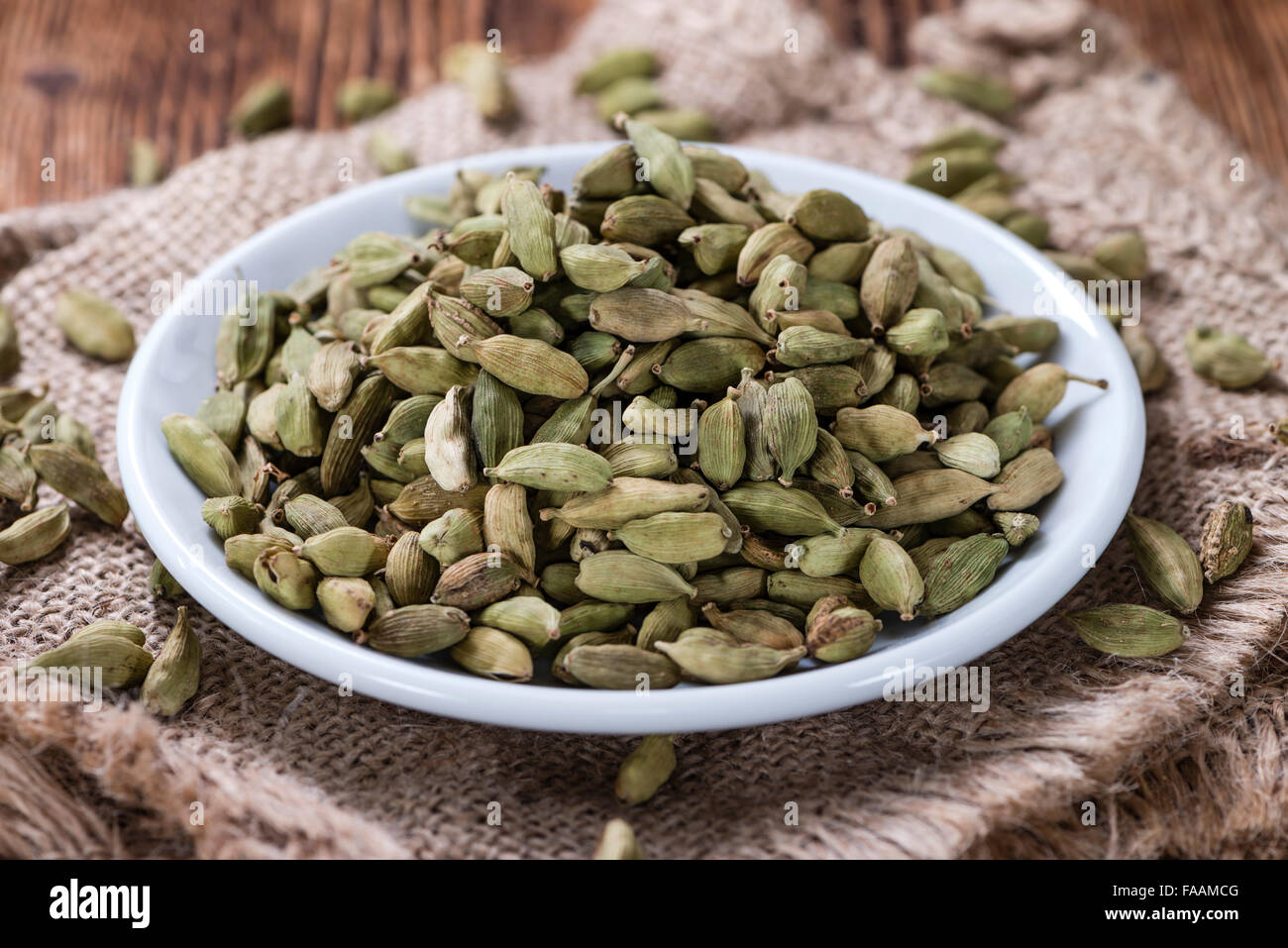 Cardamon (seeds) as close-up shot on vintage wooden background Stock ...