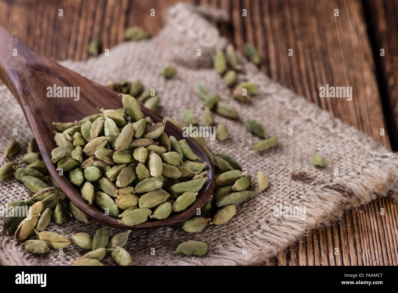 Cardamon (seeds) as close-up shot on vintage wooden background Stock ...