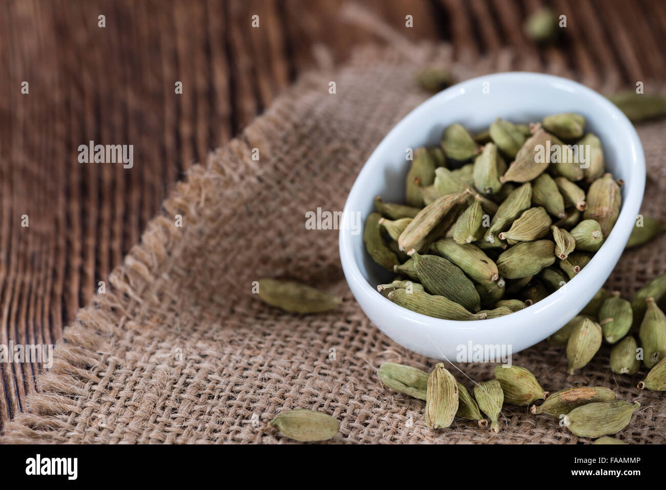 Cardamon (seeds) as close-up shot on vintage wooden background Stock ...