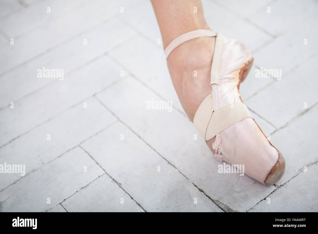 the leg of a ballerina on white background Stock Photo - Alamy