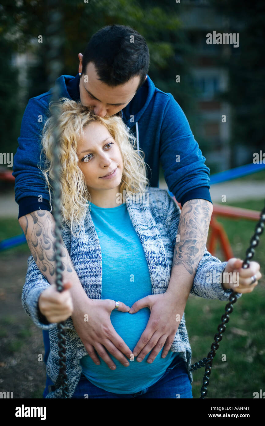 Young pregnant couple on the spring Stock Photo - Alamy