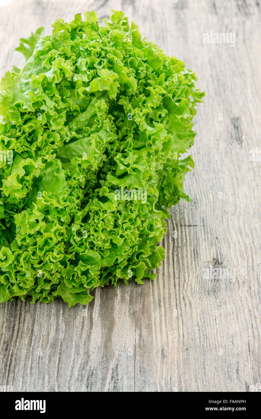 lettuce salad on a wood background Stock Photo - Alamy