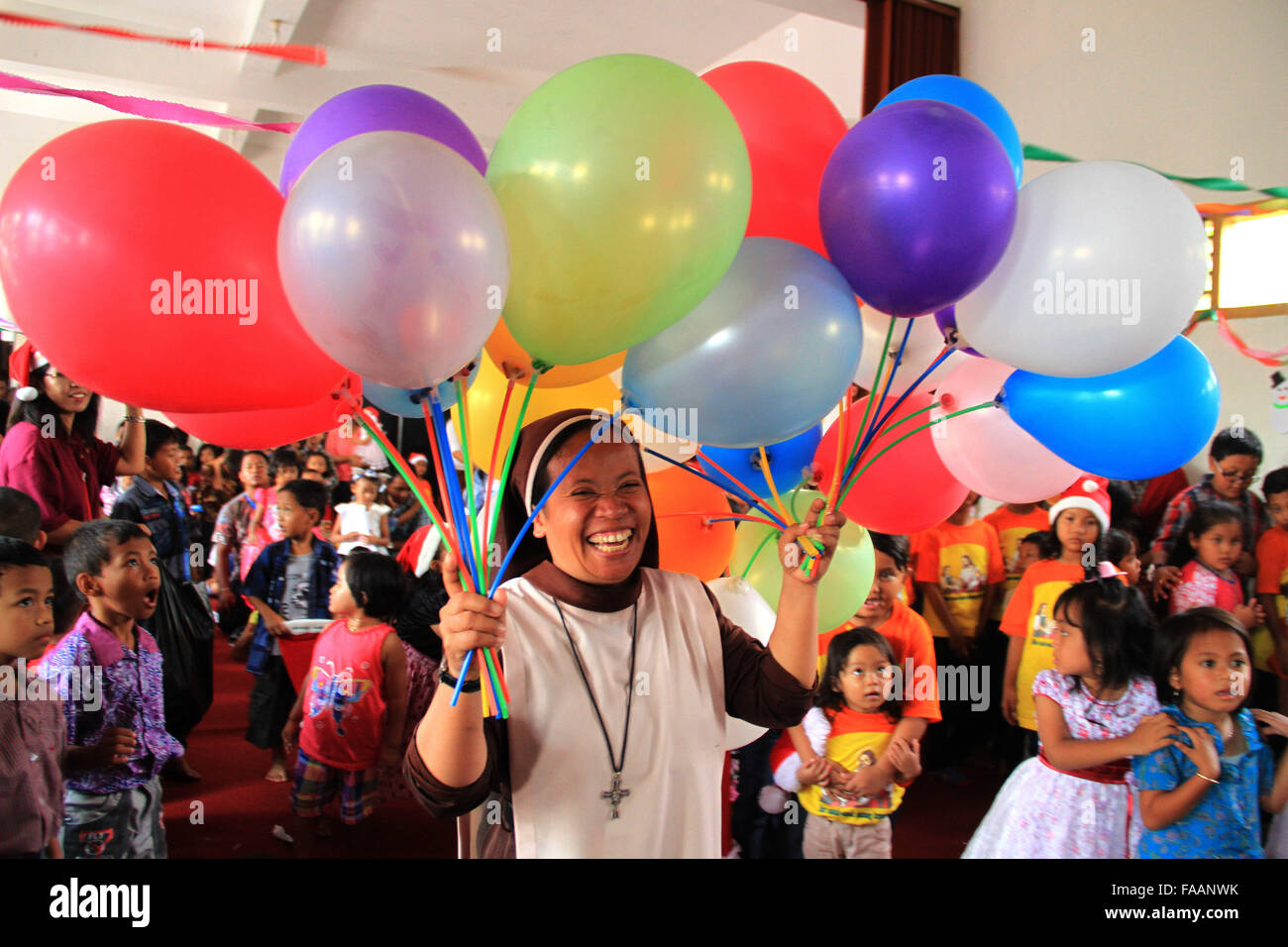 Pakem, Yogyakarta, Indonesia. 25th Dec, 2015. A Catholic nun looks ...