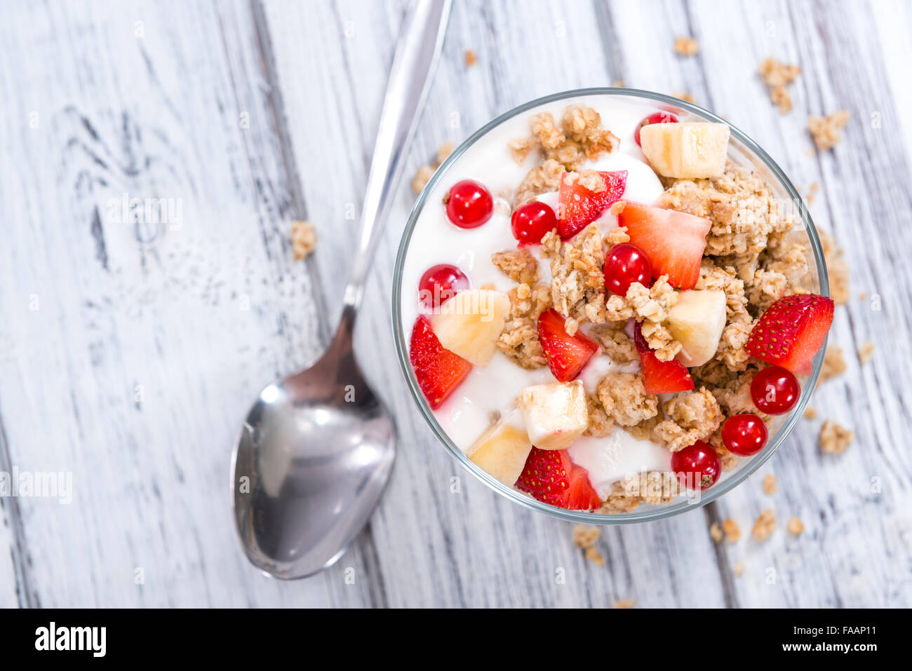 Crunchy Yoghurt (detailed close-up shot) on vintage wooden background ...