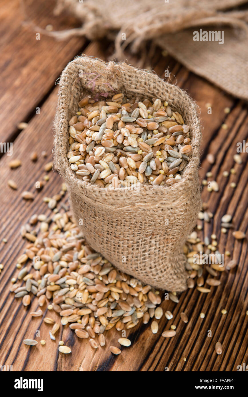 Cereals (wheat, rye, barley, oat and millet) on dark wooden background ...