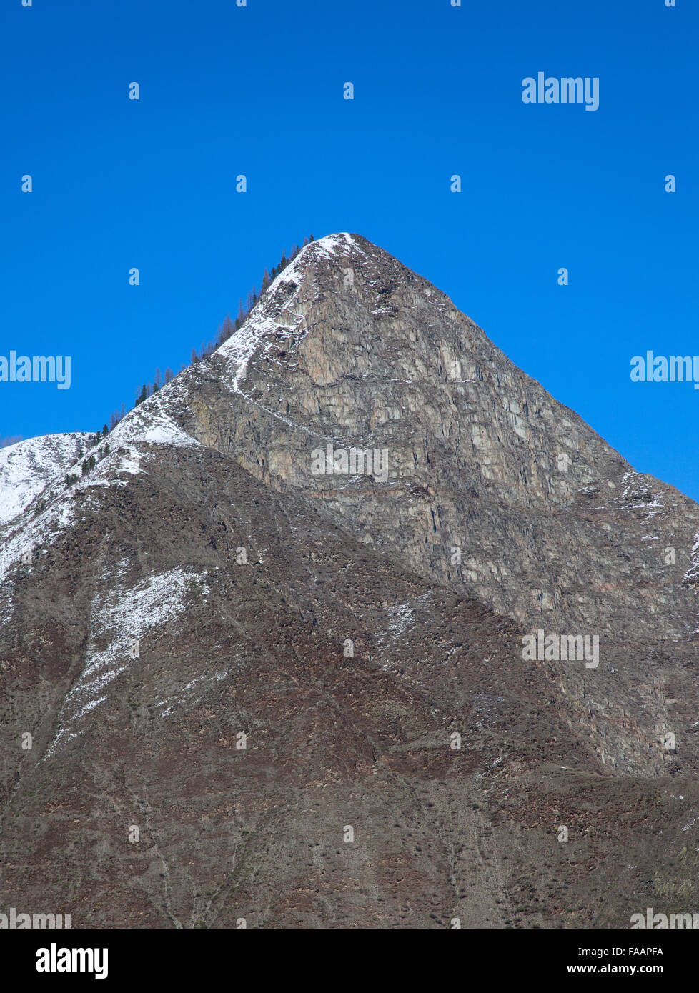 A lone mountain peak in the form of a tooth Stock Photo - Alamy