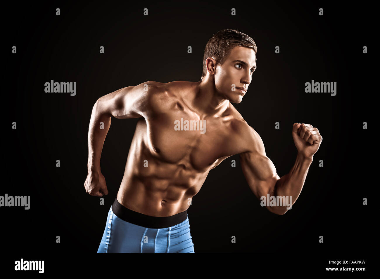 Young sporty well formed man Stock Photo - Alamy