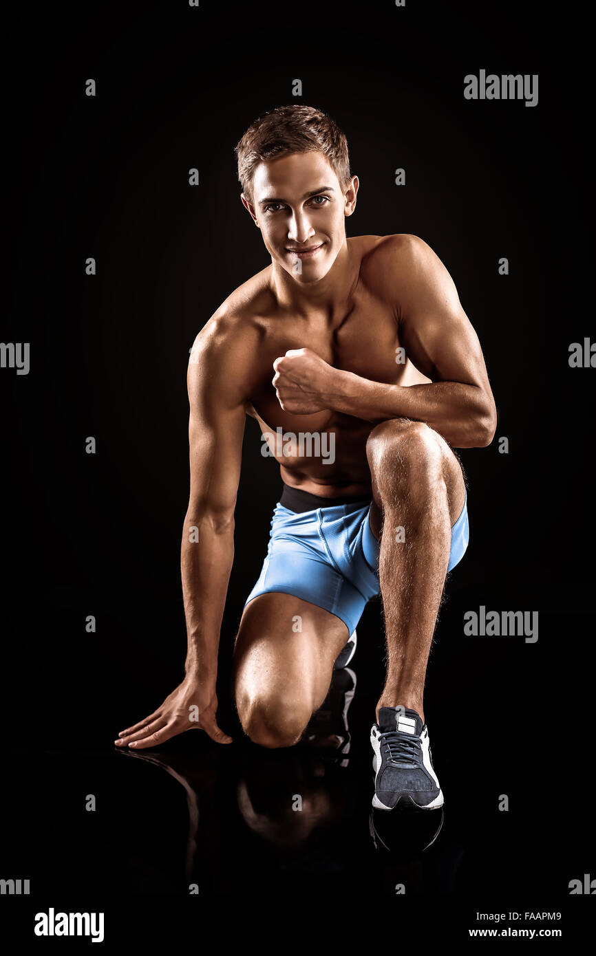 Young sporty well formed man Stock Photo - Alamy