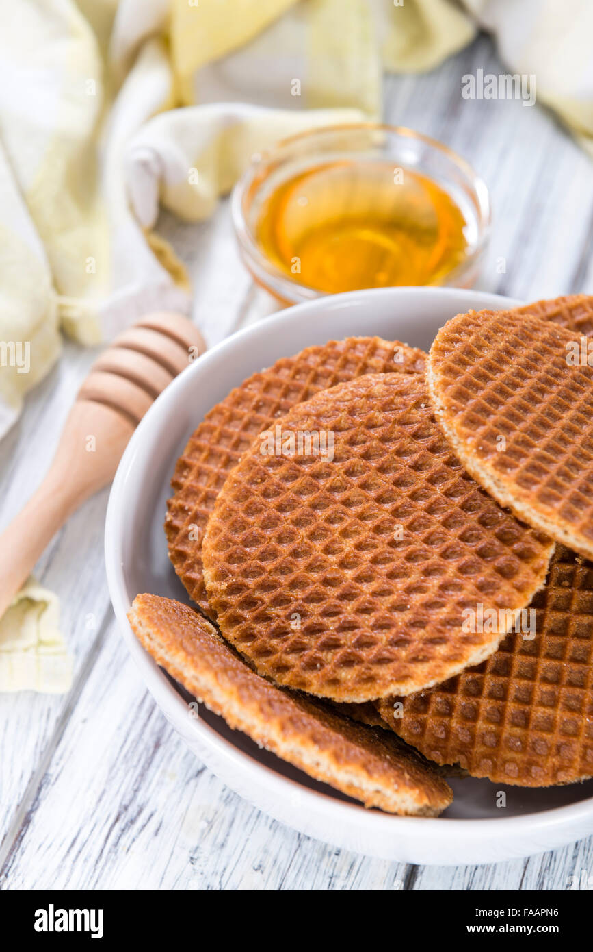 Crunchy homemade Waffles filled with golden honey (on wooden background ...