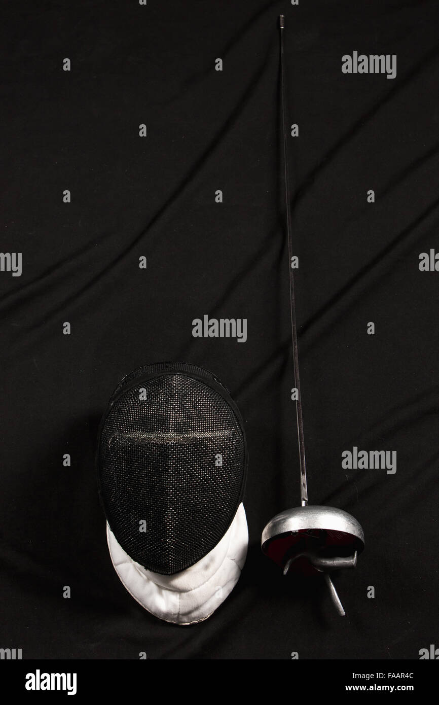The fencing mask and rapier Stock Photo - Alamy