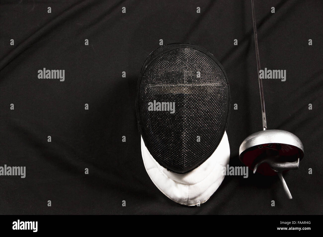 The fencing mask and rapier Stock Photo - Alamy