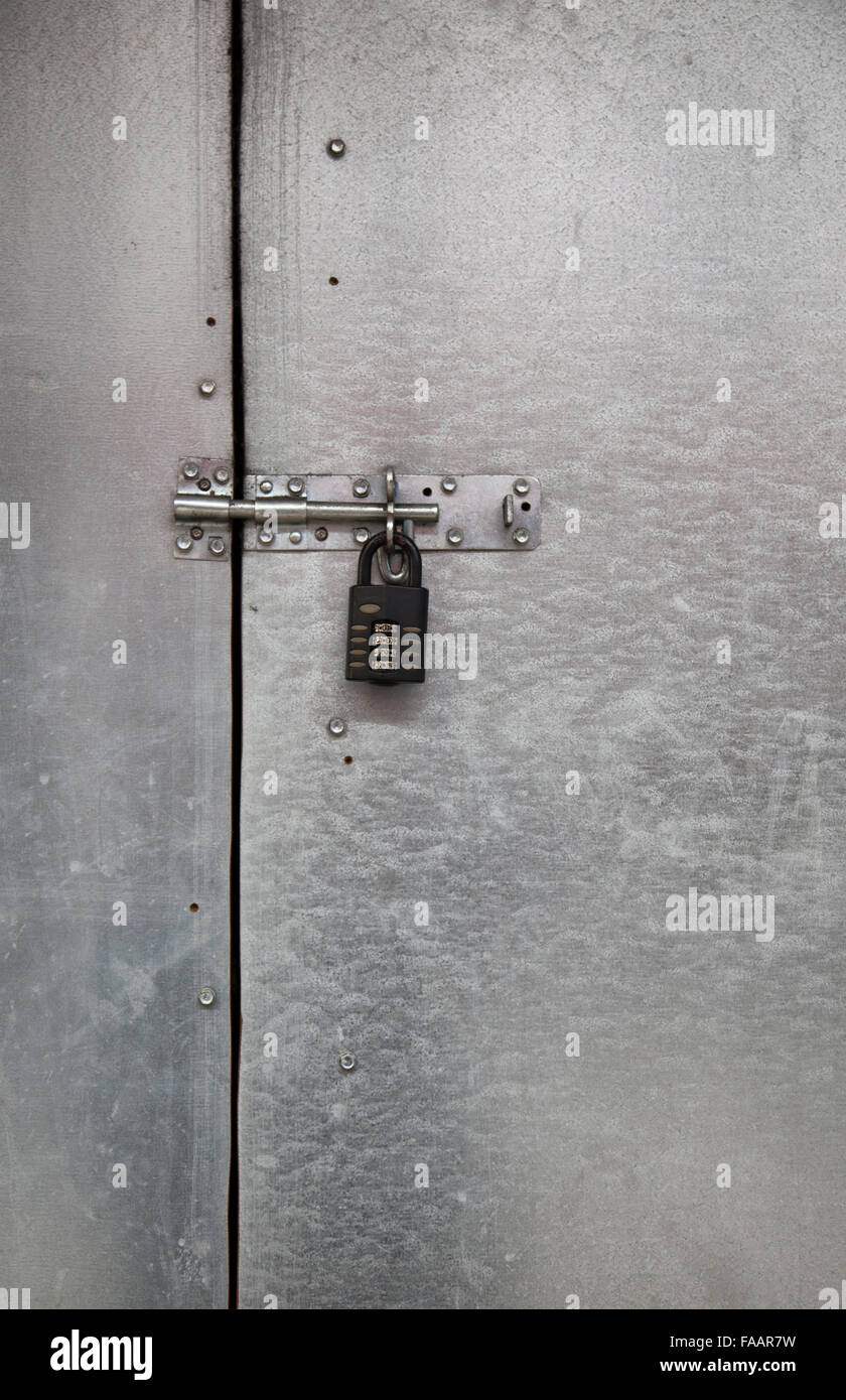 Padlock On Metal Door Stock Photo - Alamy