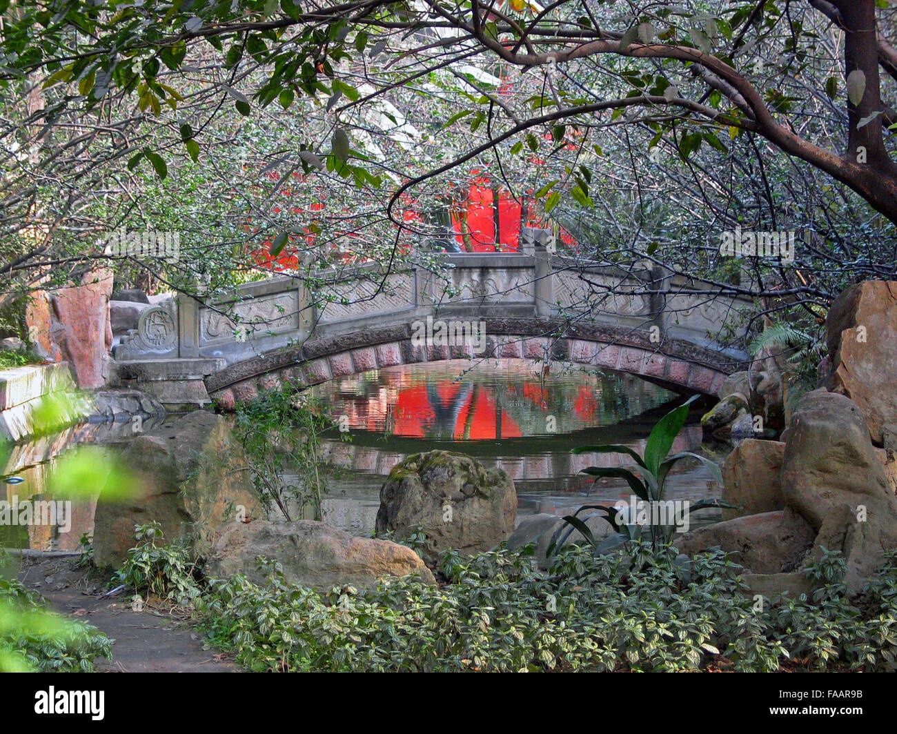 Chinese traditional garden with stone bridge in Chengdu, Sichuan ...