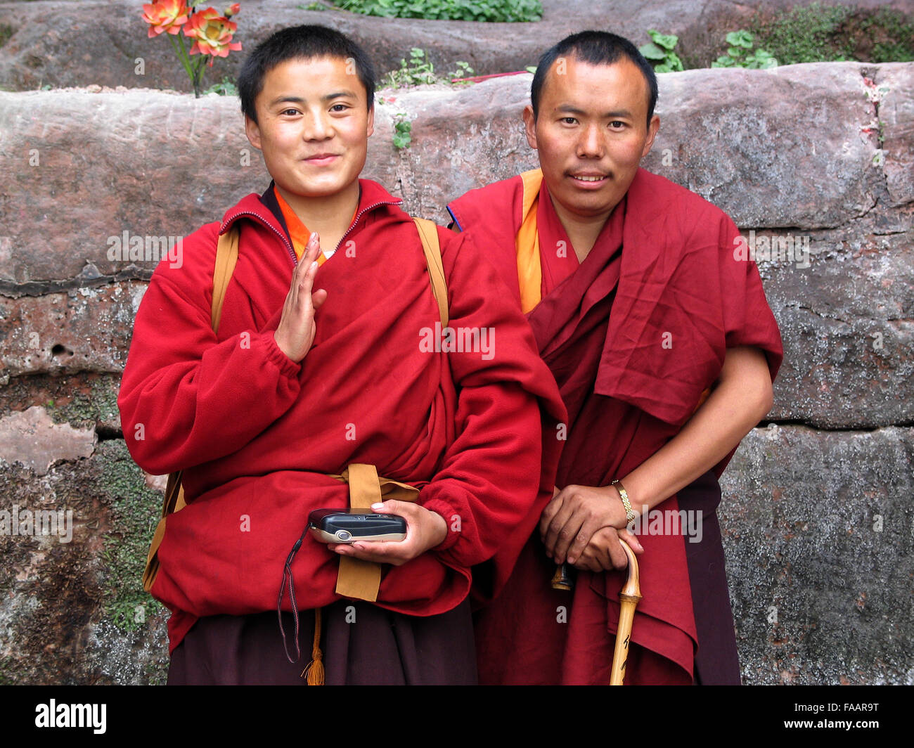 Buddhist monks smiling to the camera Stock Photo - Alamy