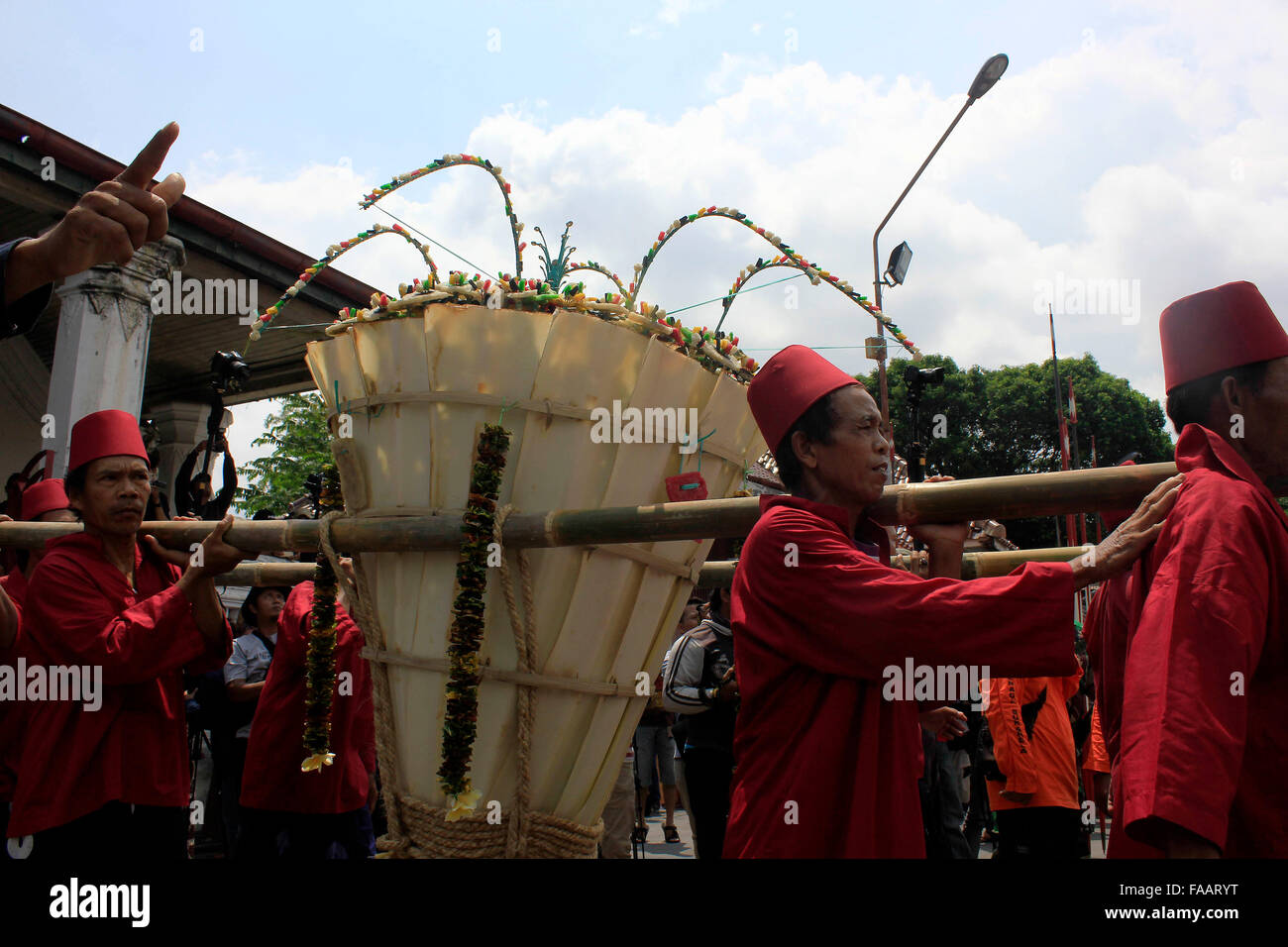 Courtiers carrying the gunungan while Grebeg Maulud of Yogyakarta ...